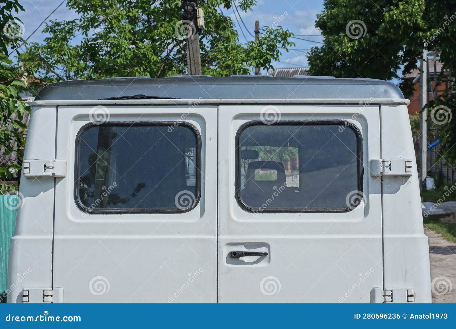 Back of an Old Minibus with Two Windows on a White Door Stock Photo ...