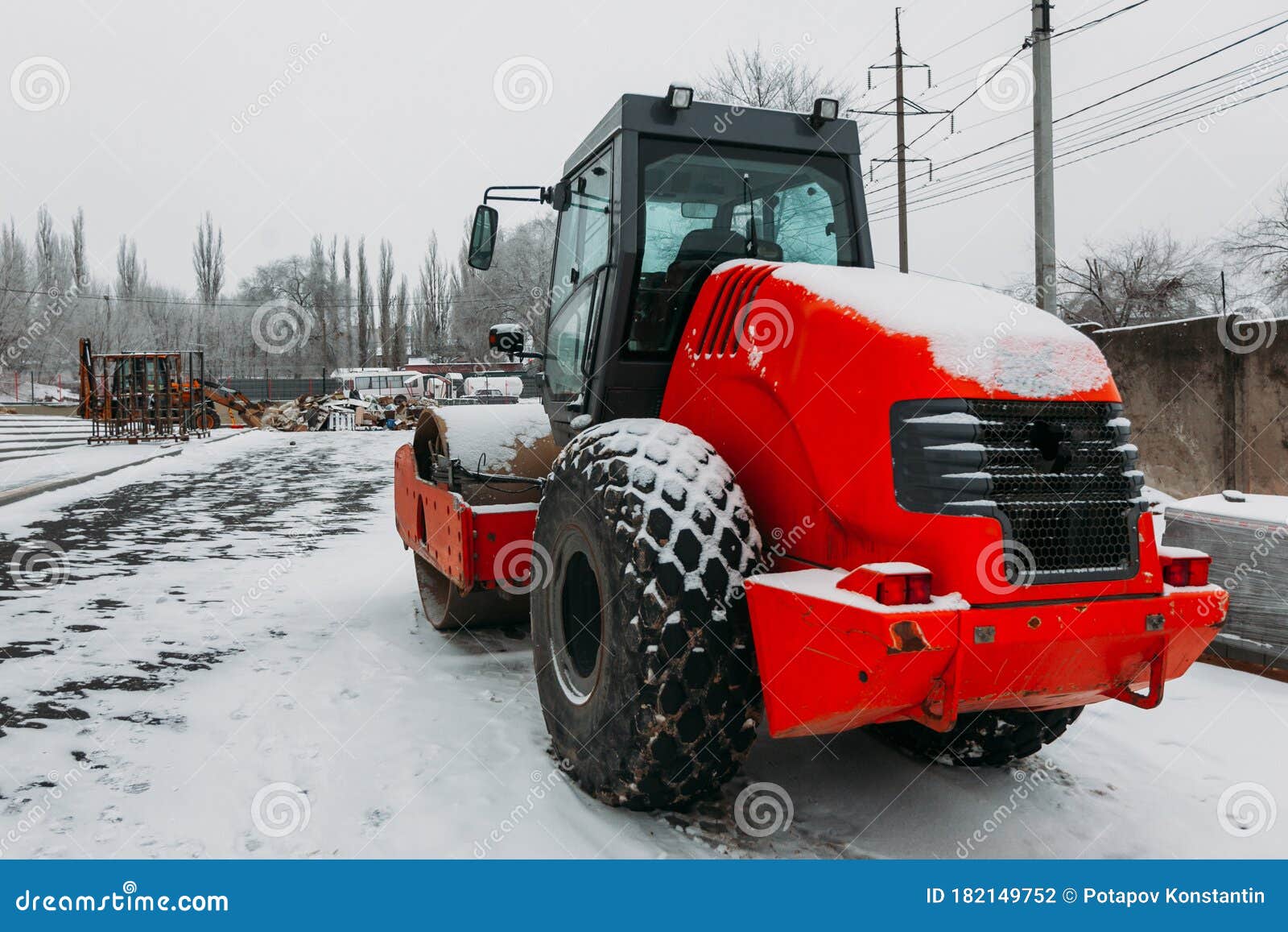 Back of an Orange Bulldozer with Big Black Wheels at a Construction ...
