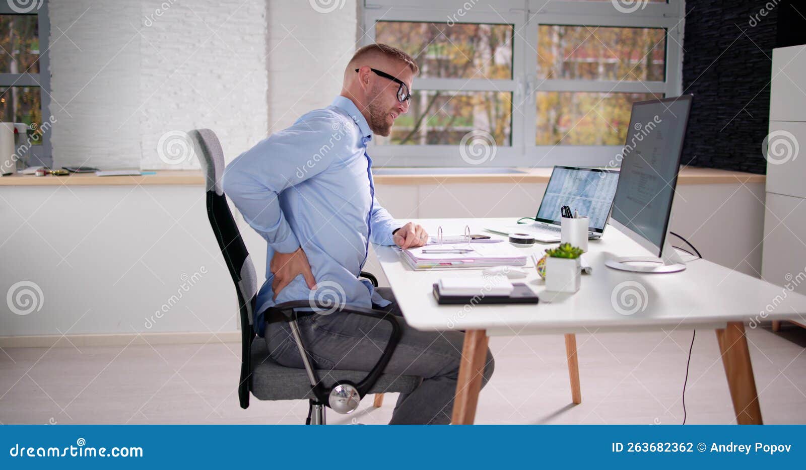 Back Pain Bad Posture Man Sitting Stock Photo - Image of sore ...