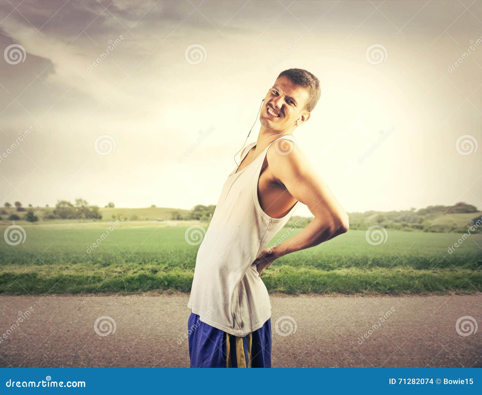 Back pain stock photo. Image of back, grass, outside - 71282074