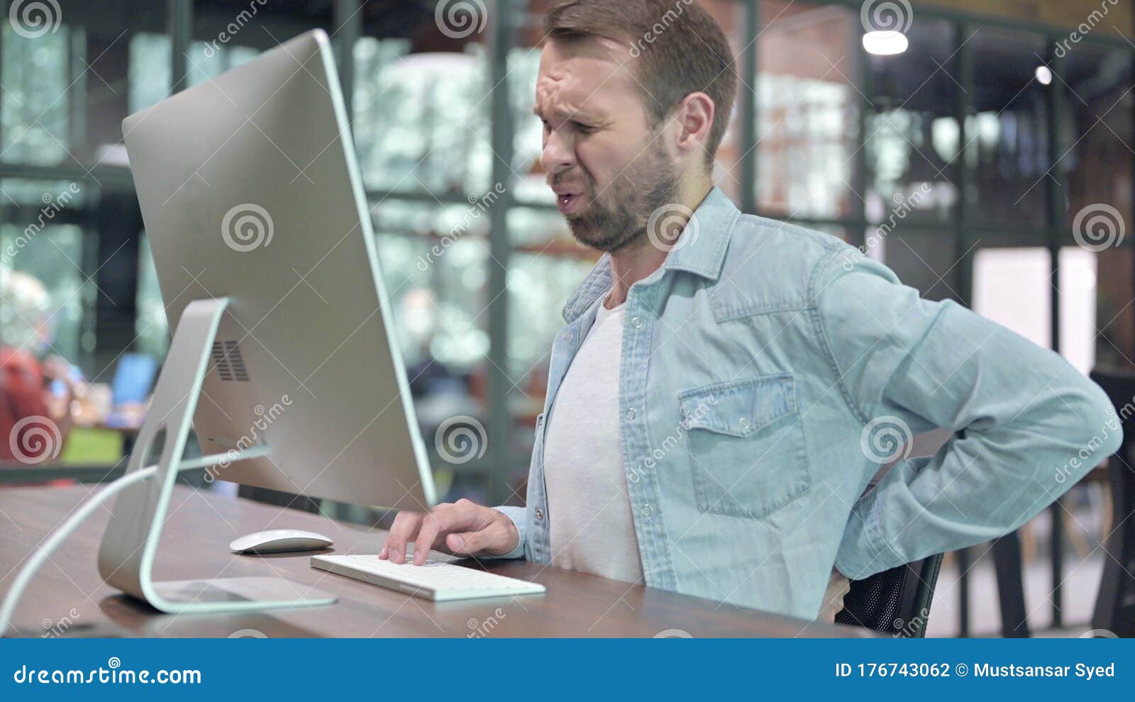 Back Pain, Uncomfortable Man Working on Computer at Work Stock Photo ...