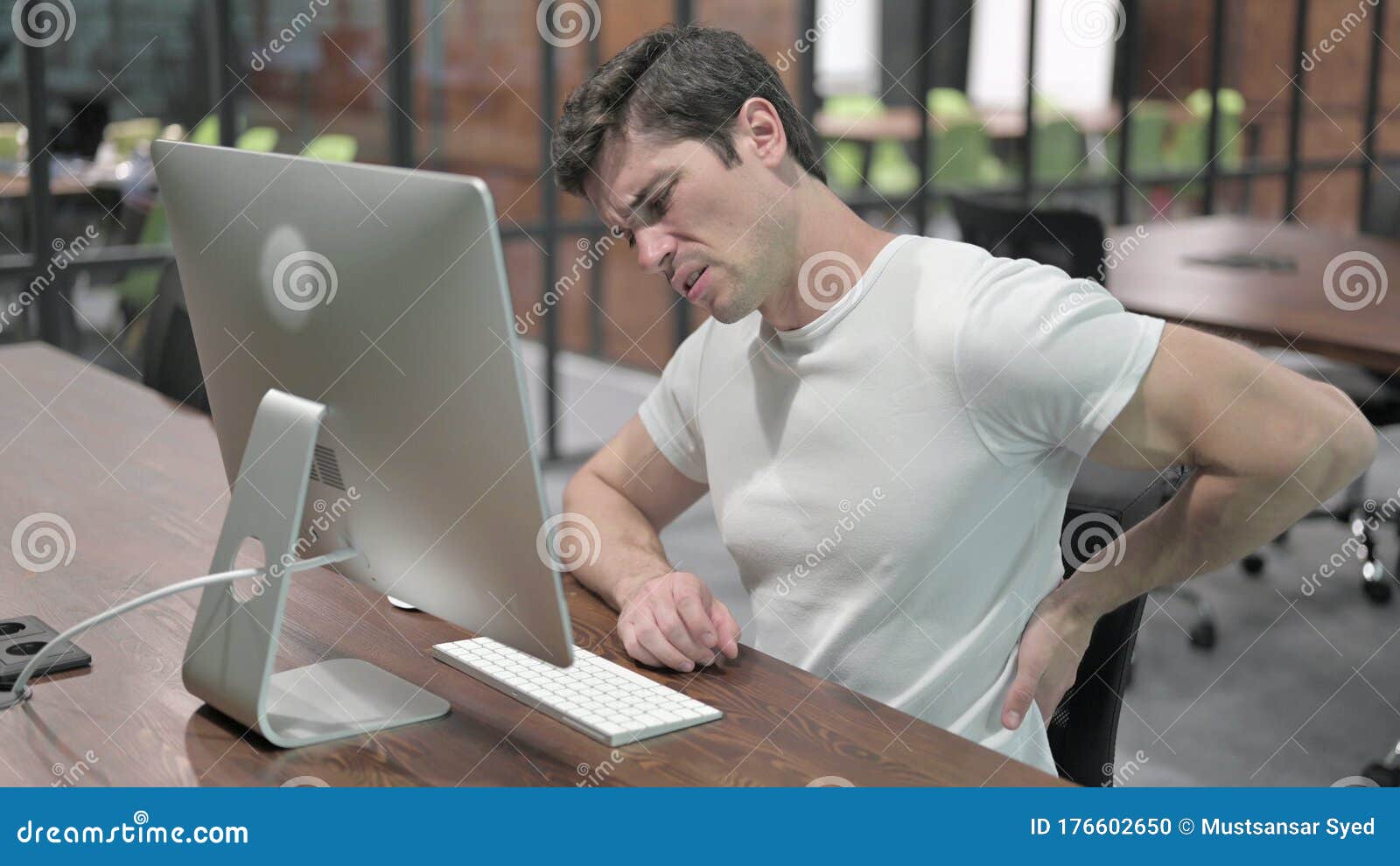 Back Pain, Uncomfortable Young Man Working on Computer Stock Photo ...