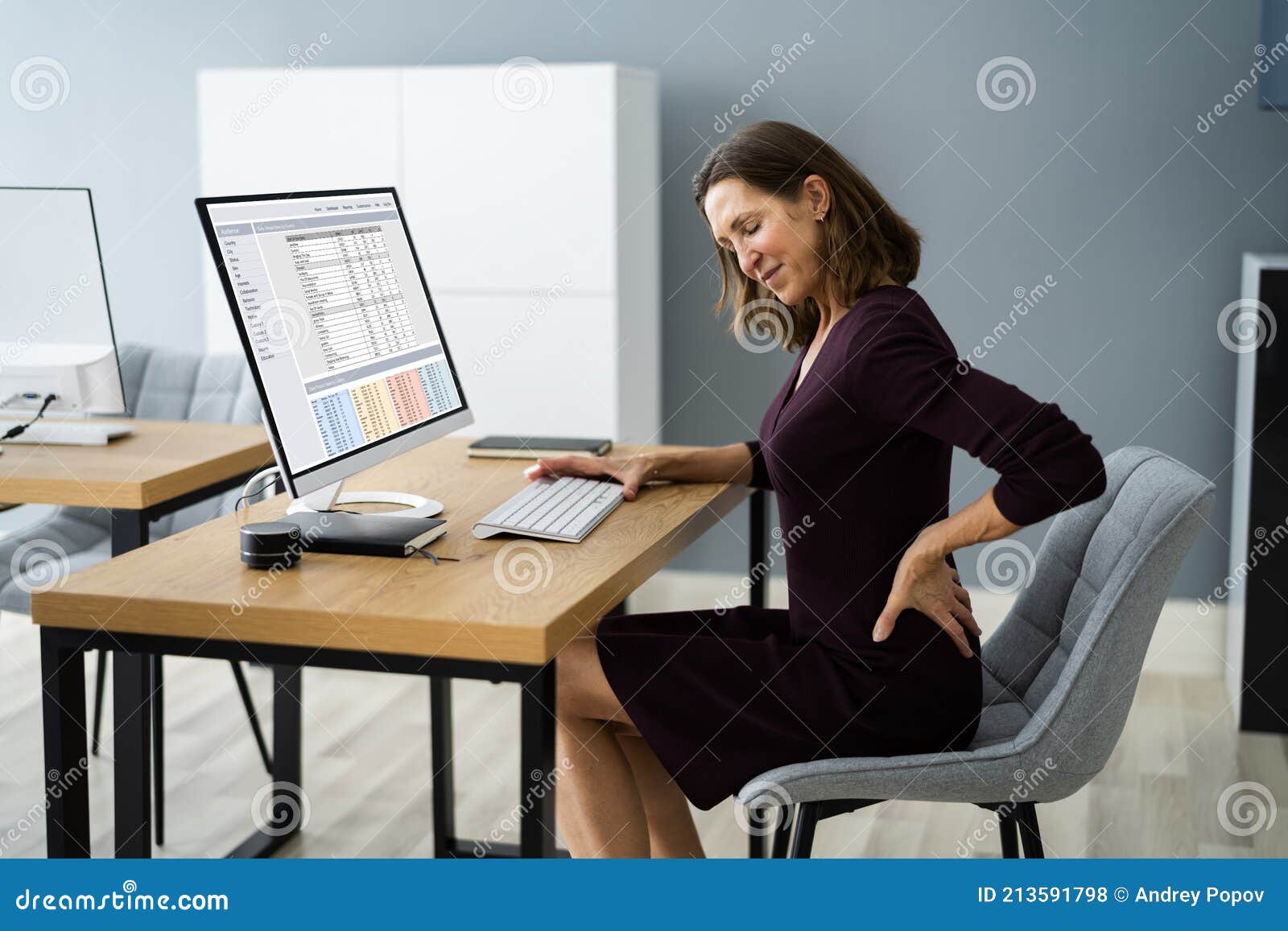 Back Pain at Work stock photo. Image of backpain, ergonomics - 213591798