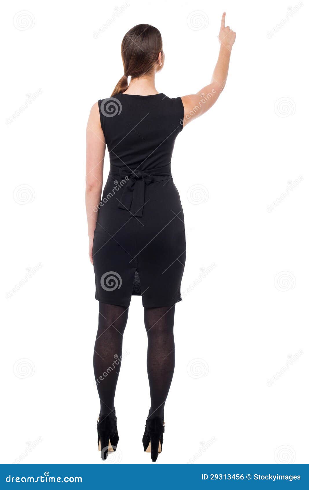Back Pose of a Female Pointing Towards the Wall Stock Photo - Image of ...