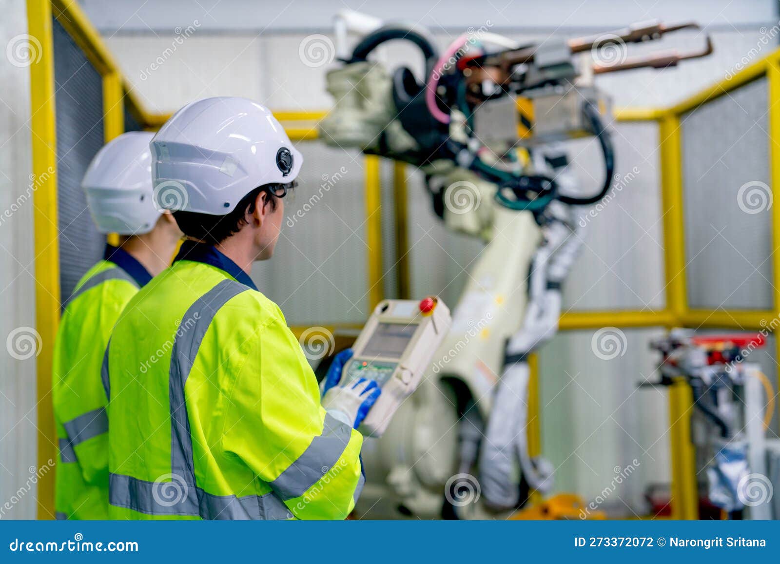 Back of Professional Technician or Engineer Use Controller To Work with ...