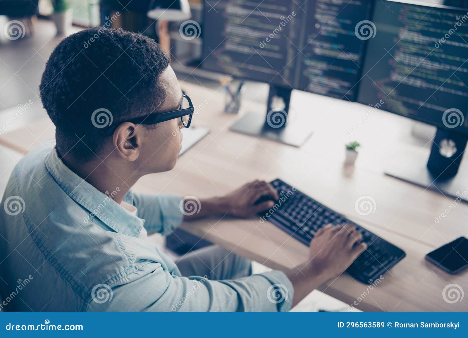 Back Rear View Photo of Young Man Sit Table Working Remote Using His ...