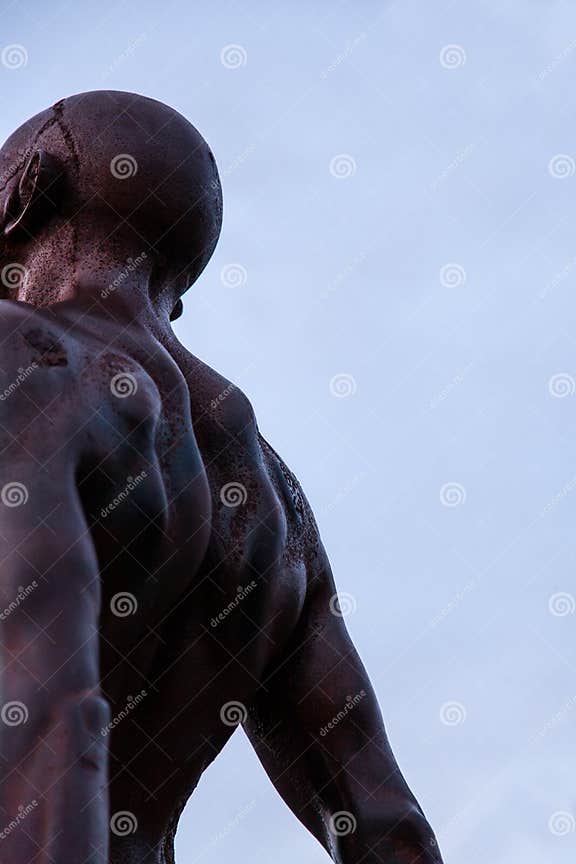 Back of Rusty Statue Man stock image. Image of perfection - 97090045