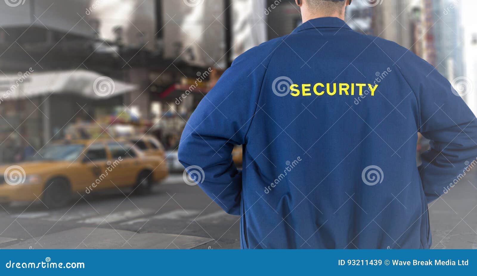 Back of Security Guard Against Blurry Street Stock Image - Image of ...