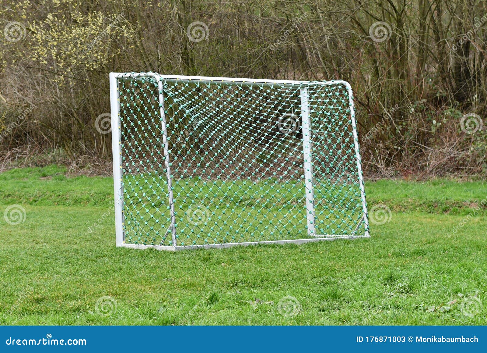 Back Side of Empty Soccer Goal with White Frame and Green Net Standing ...