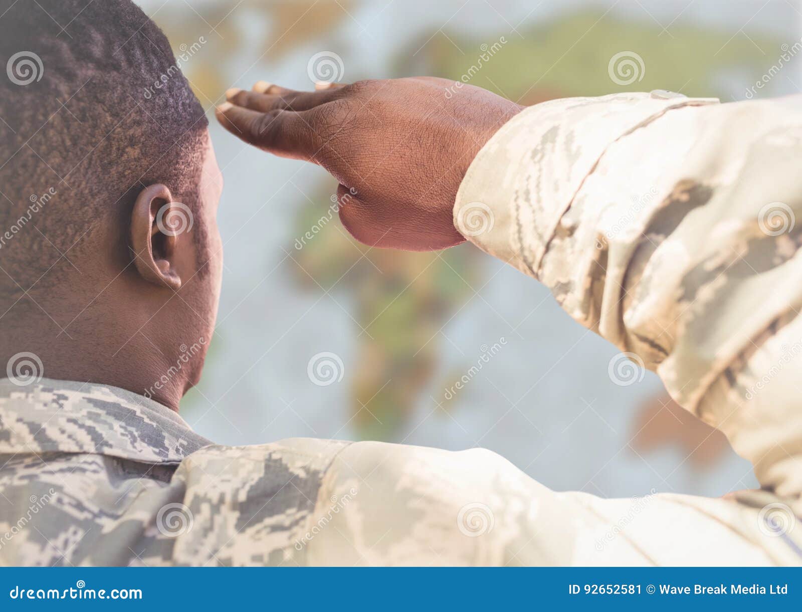 Back Of Soldier Saluting Against Blurry Map Royalty-Free Stock ...