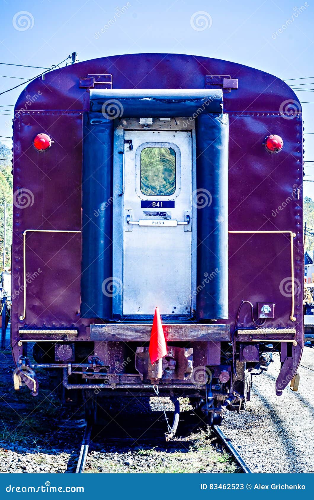 Back of a Steam Train with a Red Rail Car at the End on a Track Stock ...