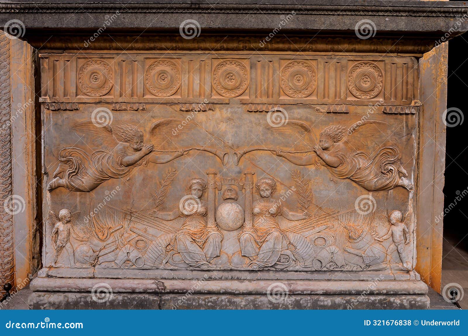 The Back of a Stone Wall with a Design of Angels and a Sphere Stock ...