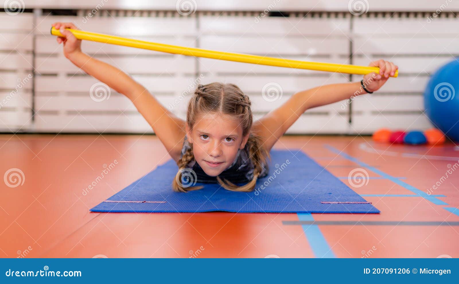 Back Strengthening Exercise for Children with a Bar Stock Photo - Image ...