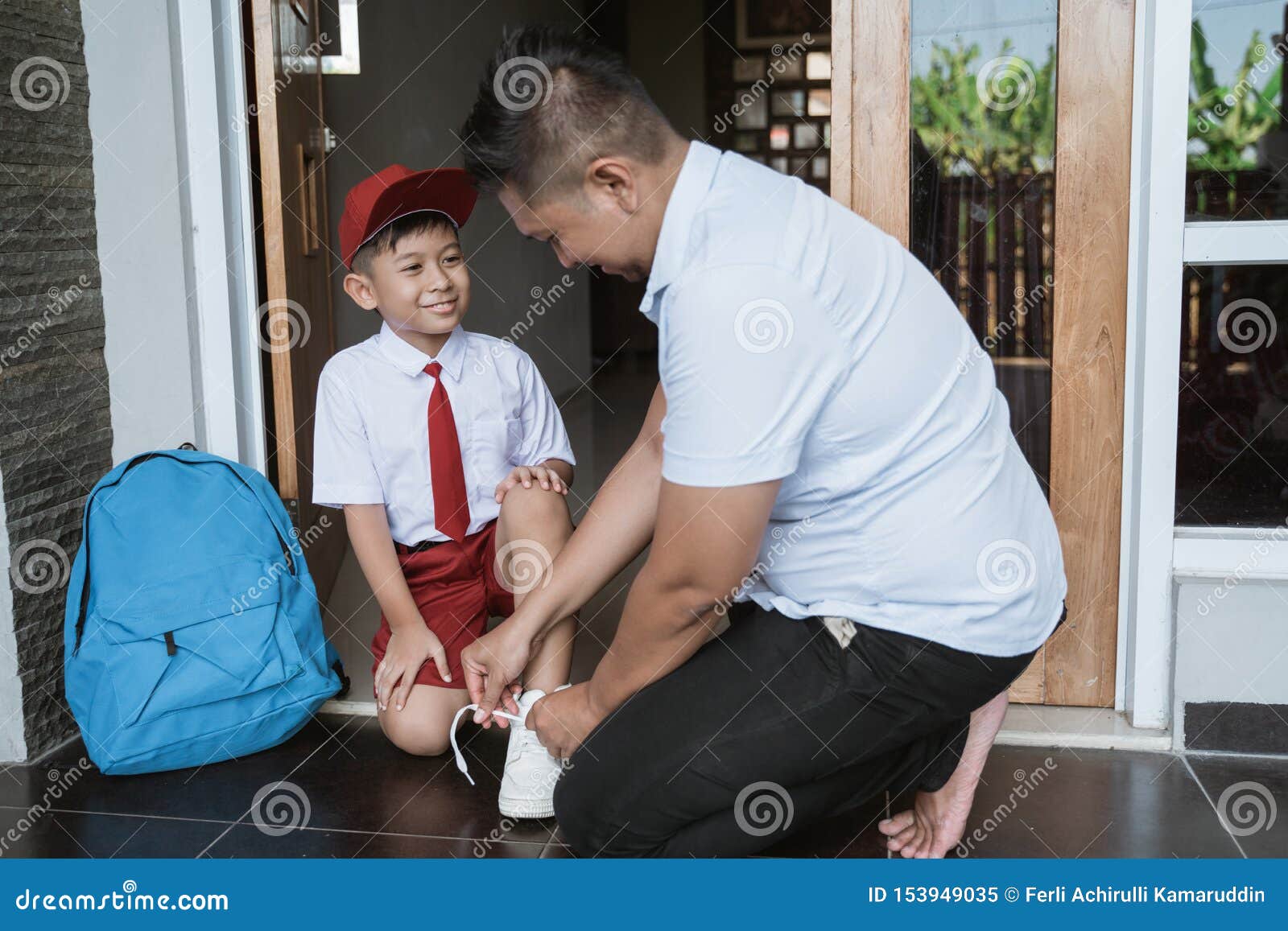 Asian Elementary Student Getting Ready for School with Father Stock ...