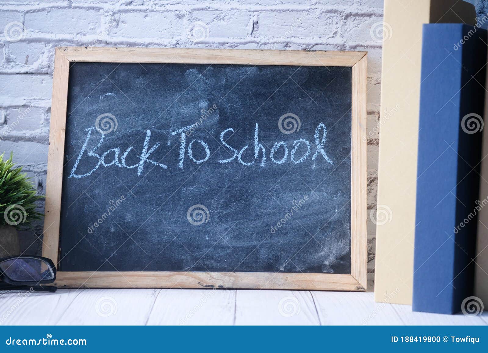Back To School Concept with Chalkboard and Stack of Book on Table Stock ...