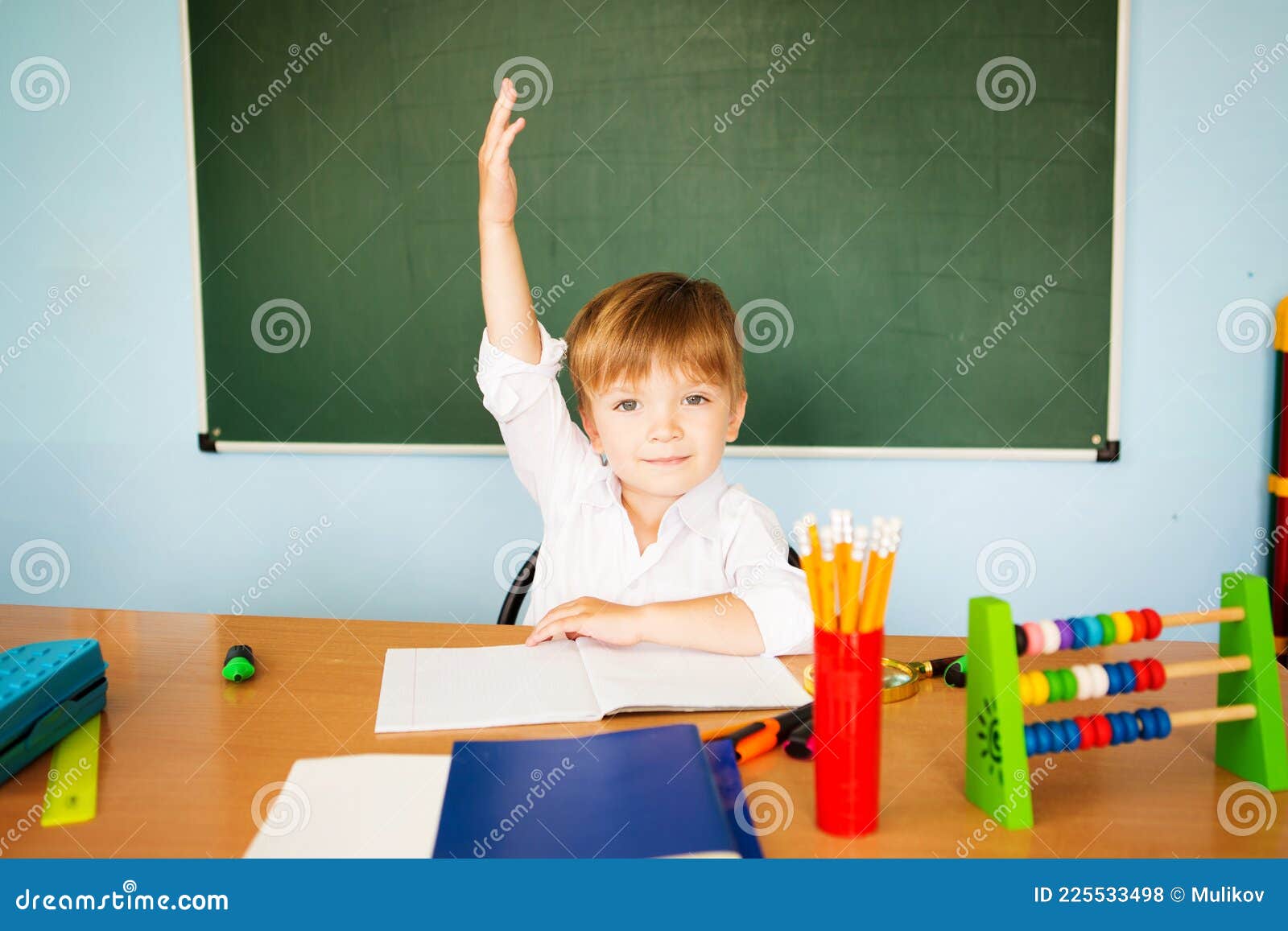 Back To School Concept. Cheerful Schoolboy Ready To Answer Question ...