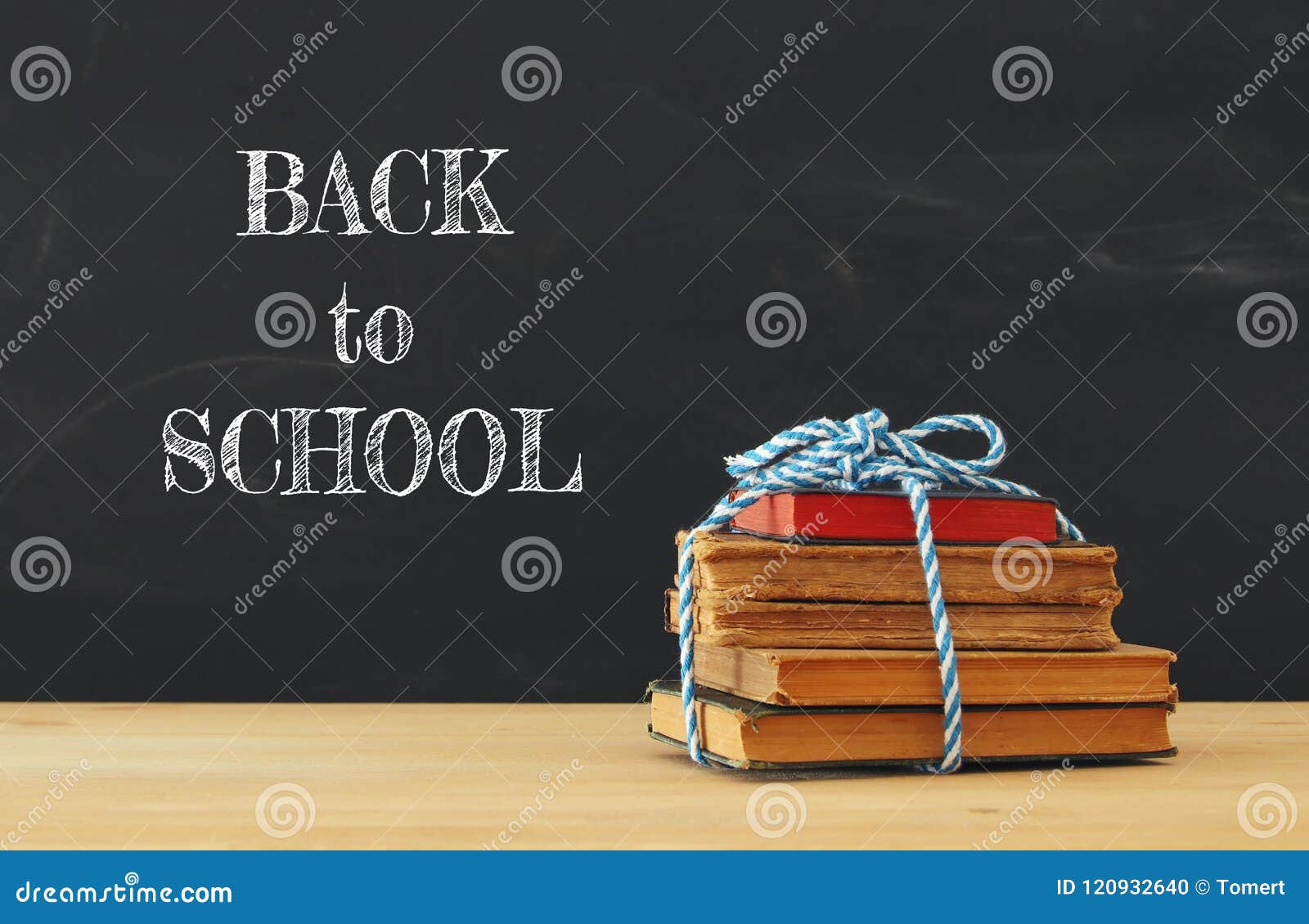 Back To School Concept. Stack of Books Over Wooden Desk in Front of ...