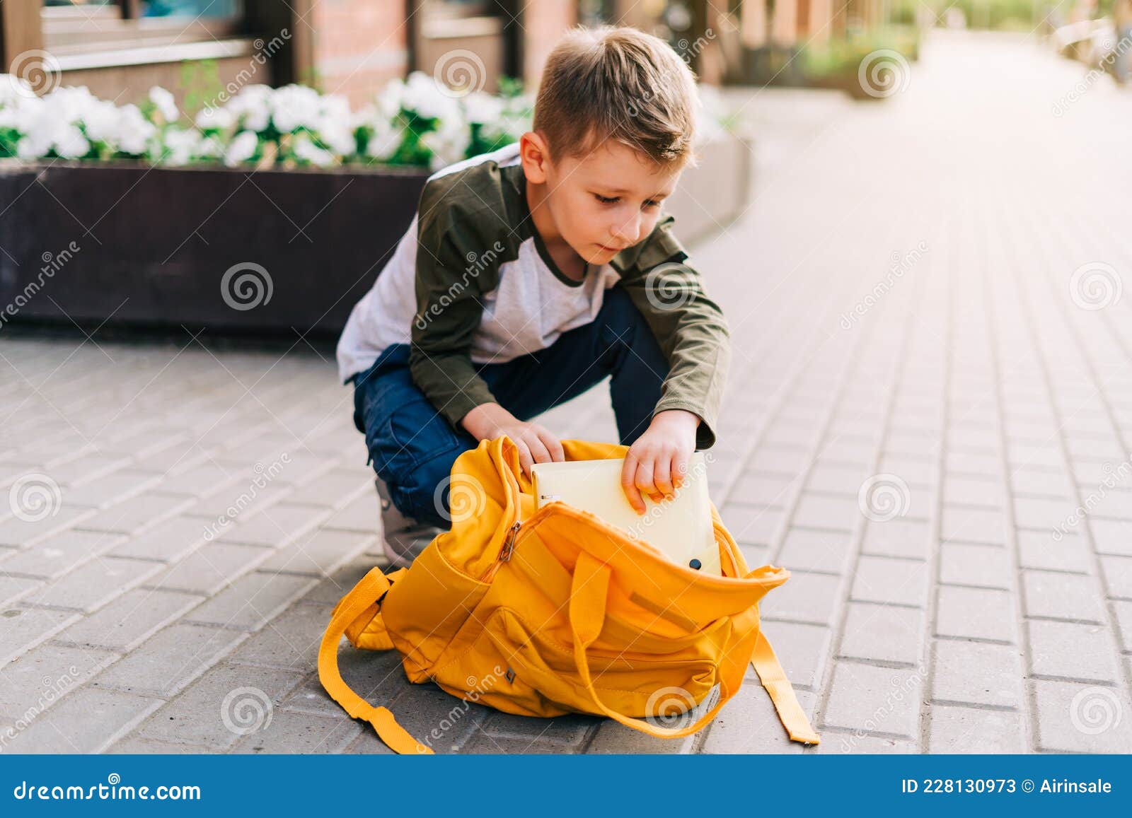 Back To School. Cute Child Packing Backpack, Holding Notepad and ...