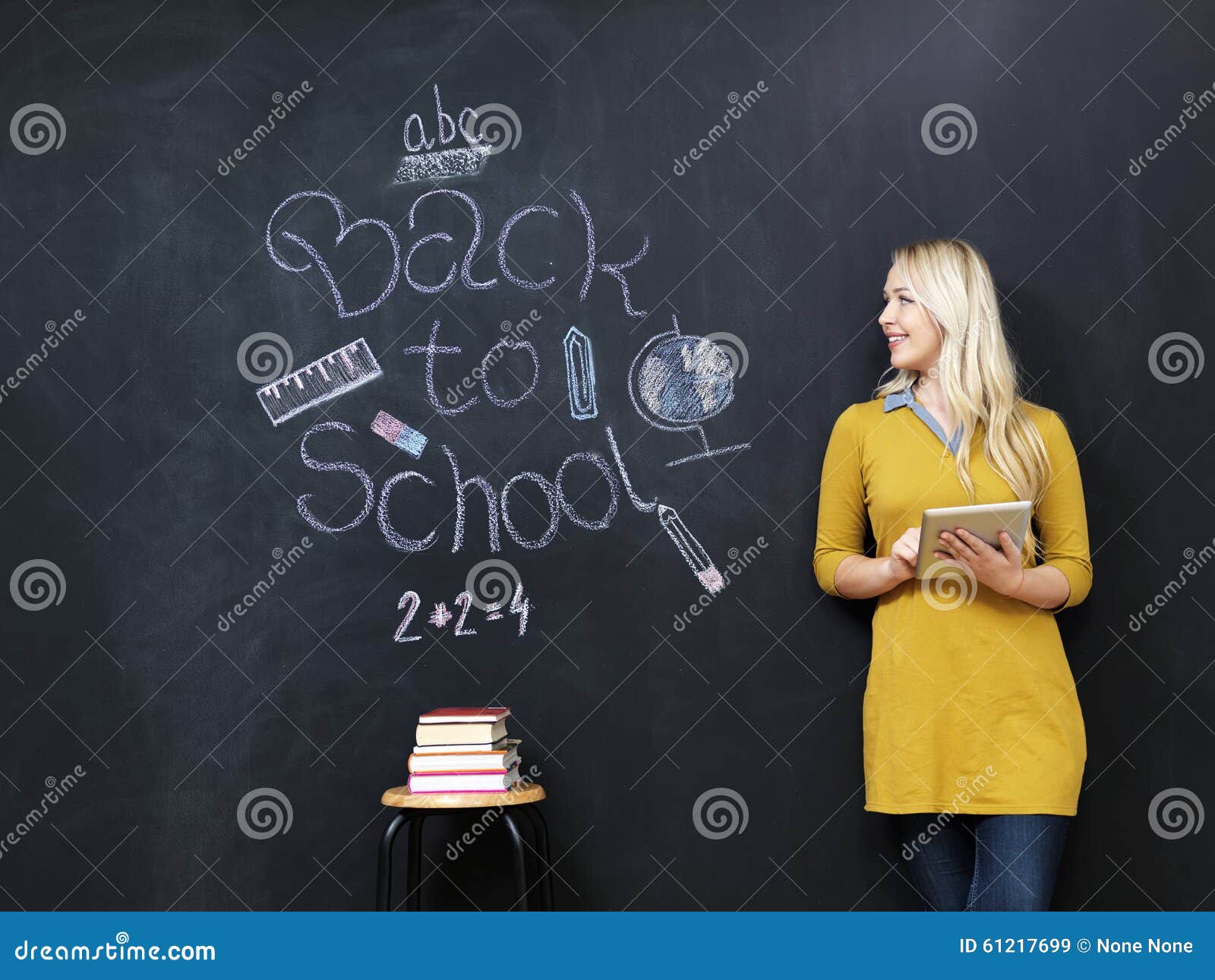 Back To School Female Teacher Smiling By Blackboard Stock Image Image
