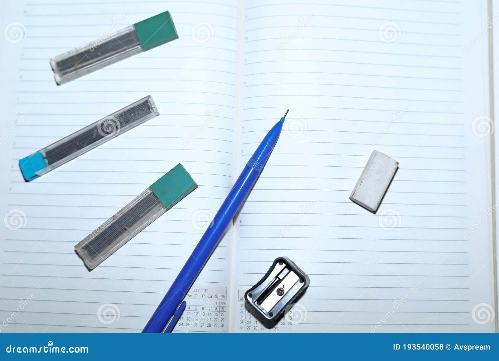 Back To School with Pencil Sharpener, Pencil, Eraser on Top of Notebook ...