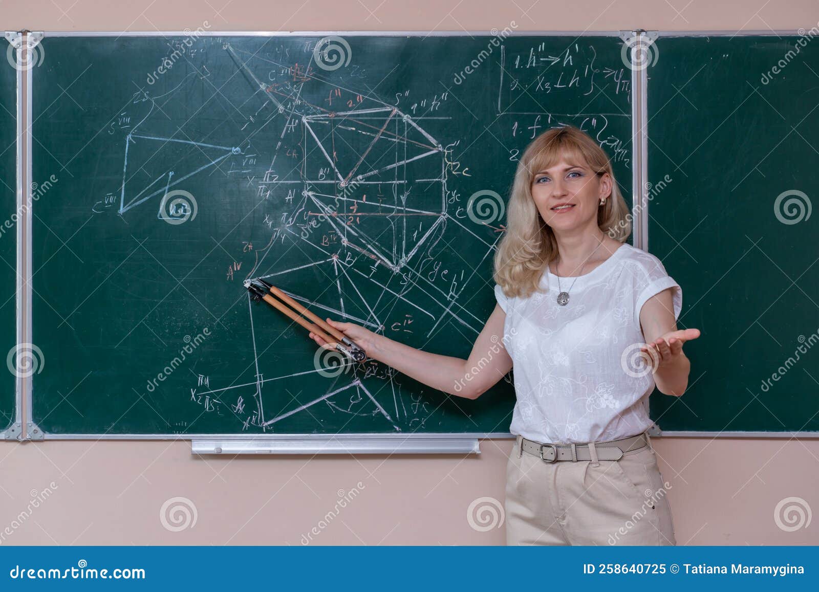 Back To School. the Professor Solves the Problem at the Blackboard ...