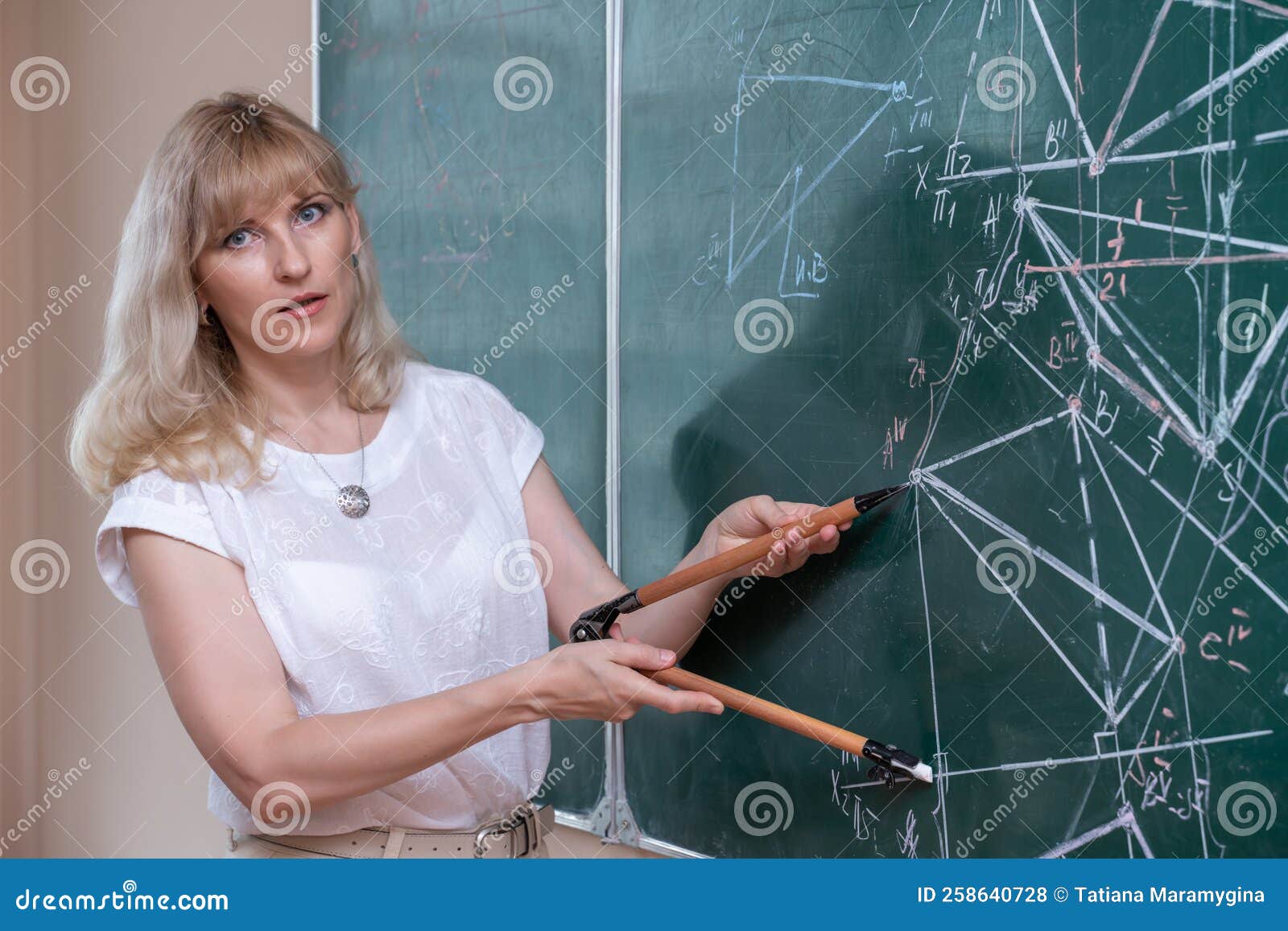 Back To School. the Professor Solves the Problem at the Blackboard ...