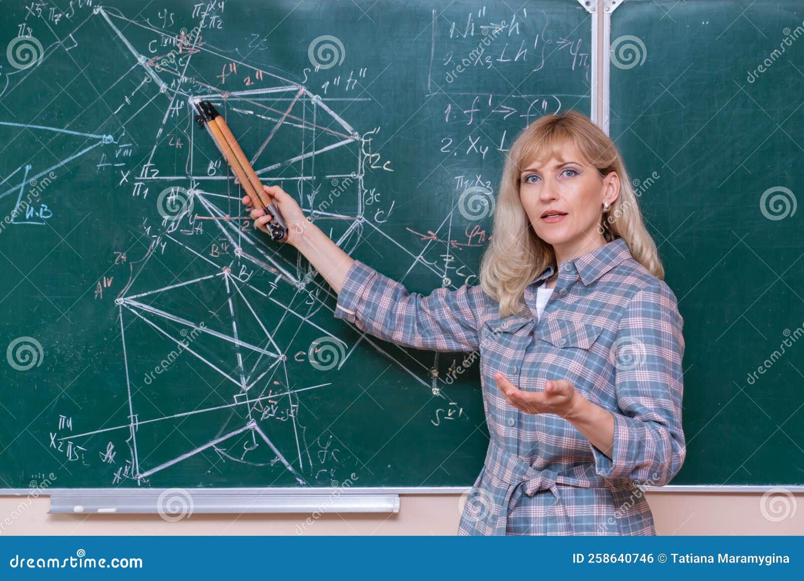 Back To School. the Professor Solves the Problem at the Blackboard ...