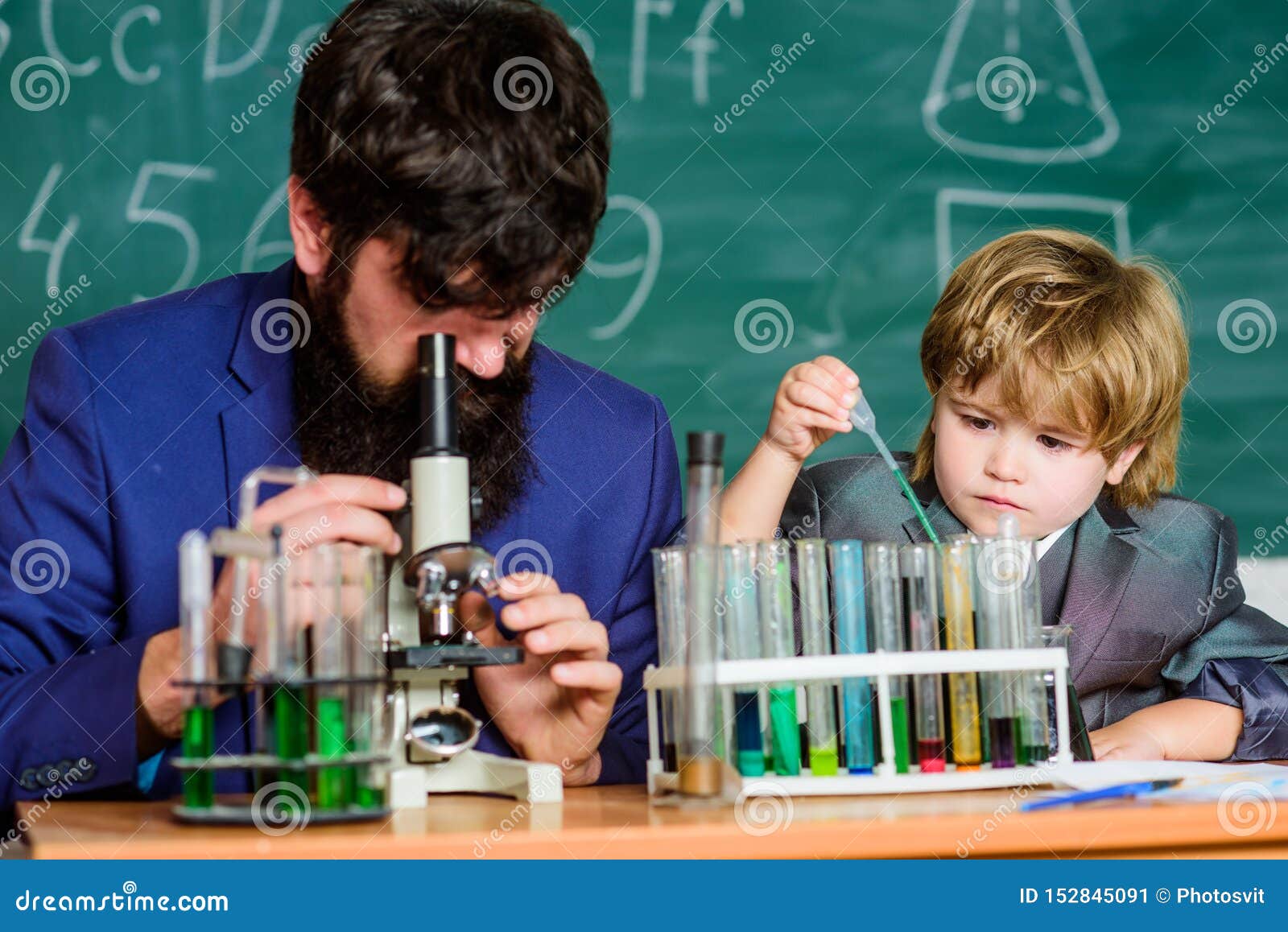 Back To School. Student Doing Science Experiments with Microscope in ...