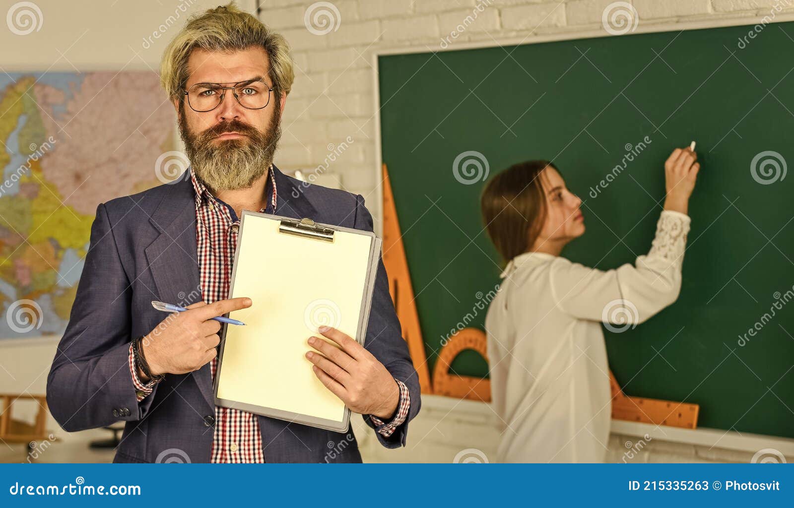 Back To School. Student and Teacher in Classroom. Teacher Checking ...