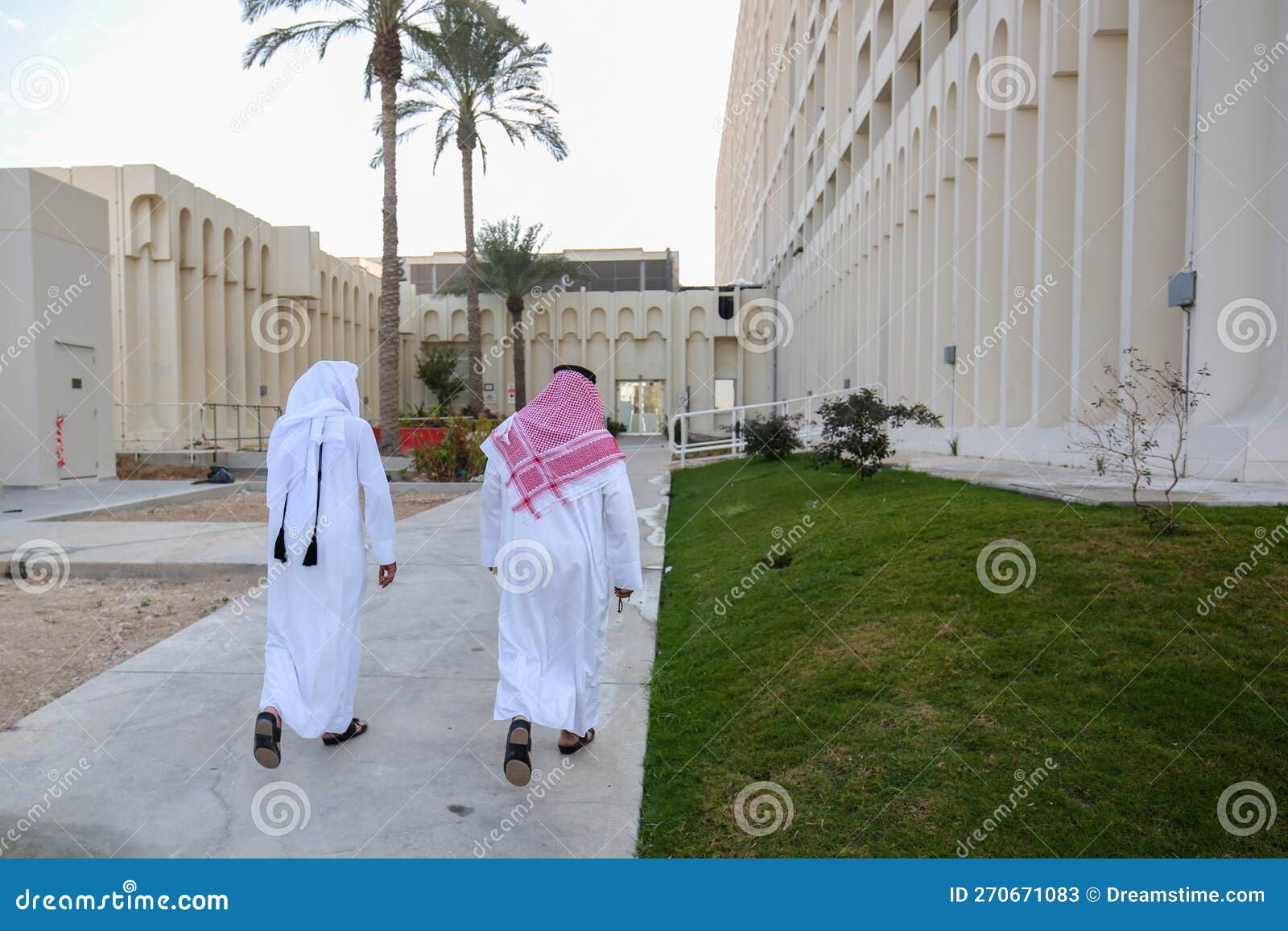 Back of Two Arabic Men Walking in Qatar Stock Image - Image of kandora ...