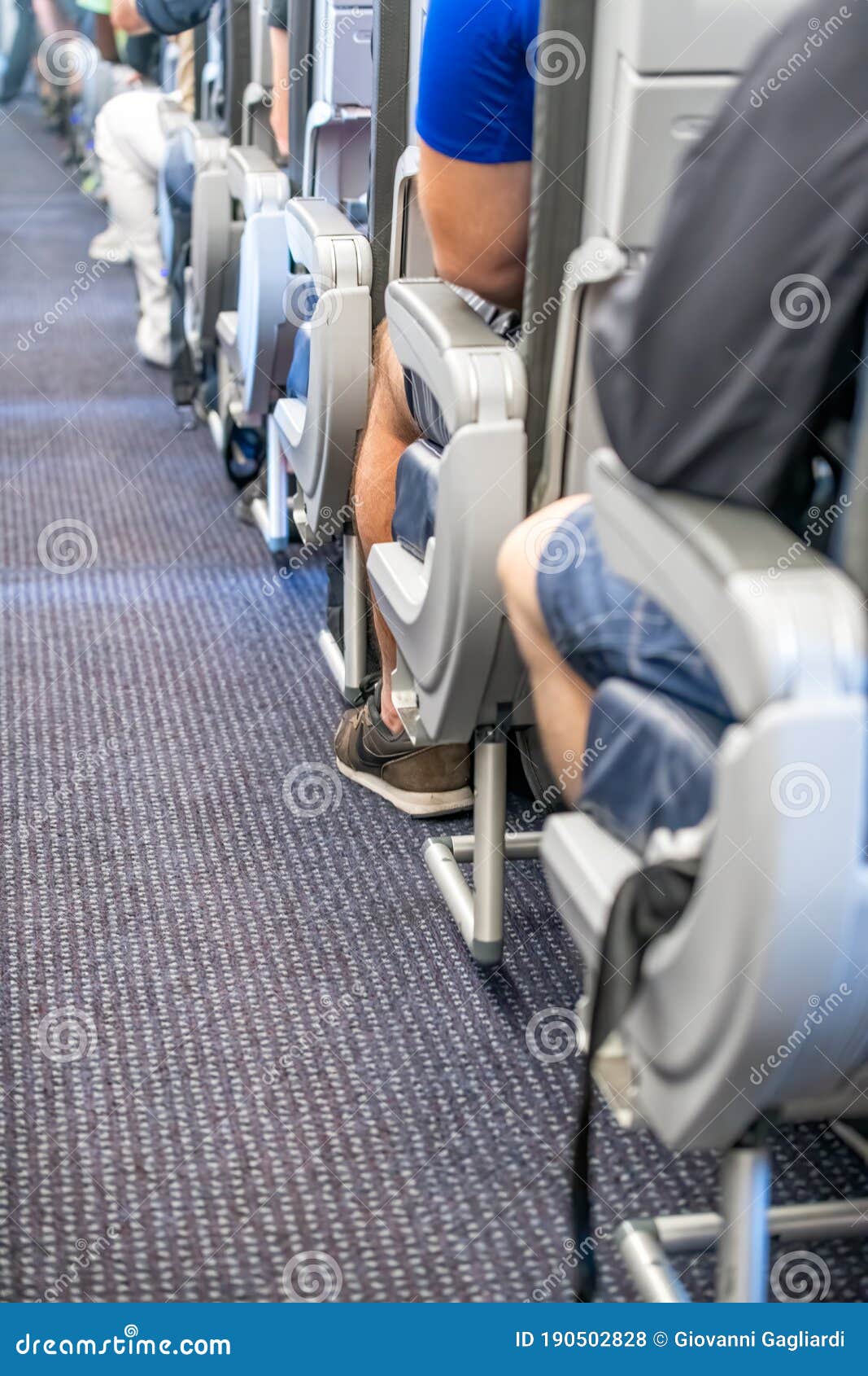 Back View of Airplane Aisle and Seats during Flight Stock Photo - Image ...