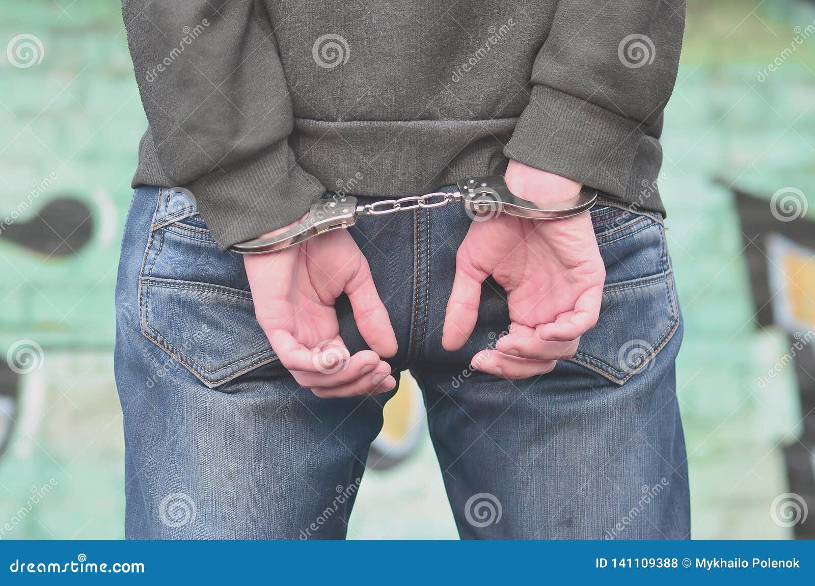 Back View of the Arrested Bandit from the Ghetto Against the Gra Stock ...