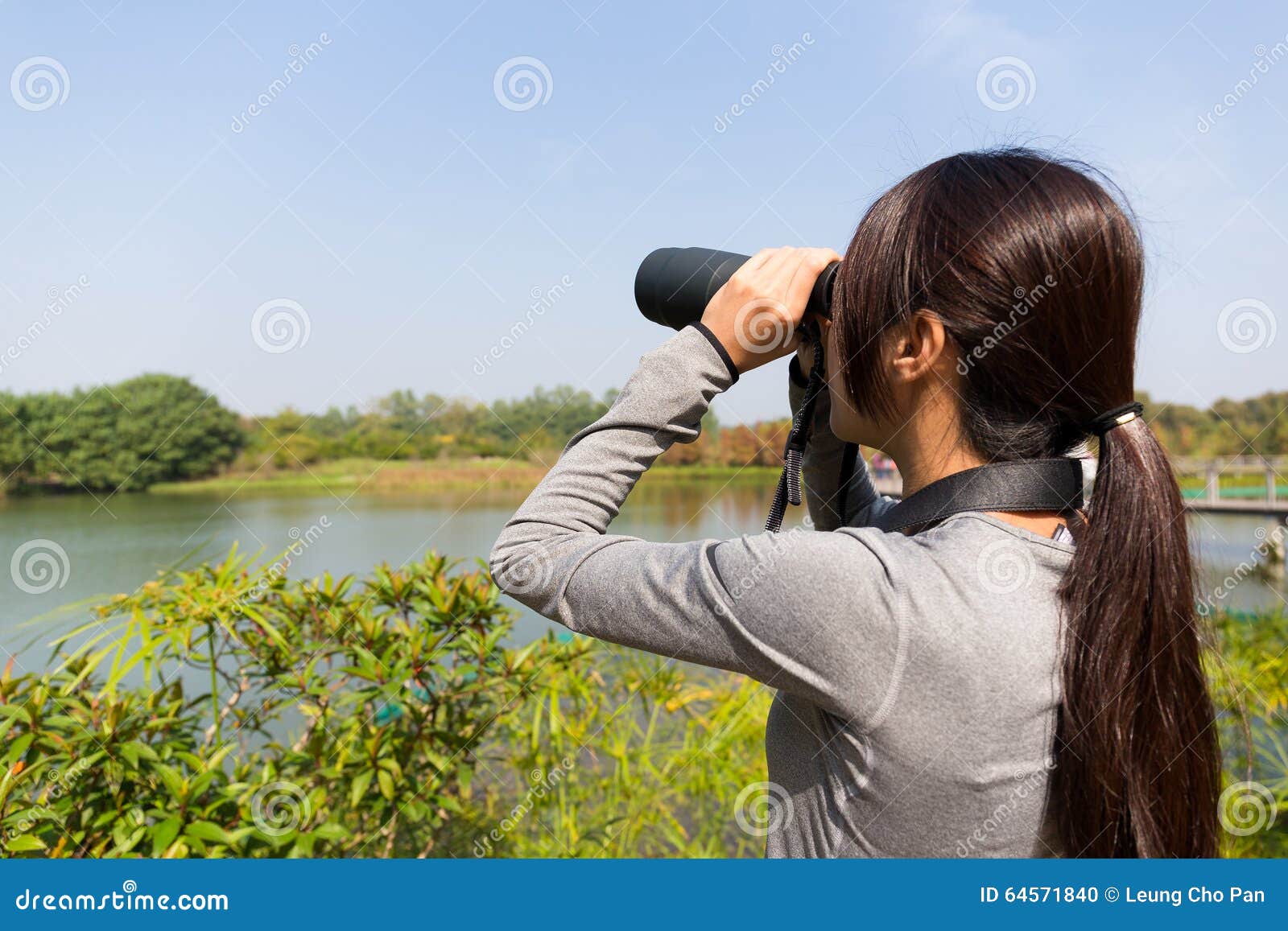 The Back View of Asian Young Woman Using Binocular Stock Photo - Image ...