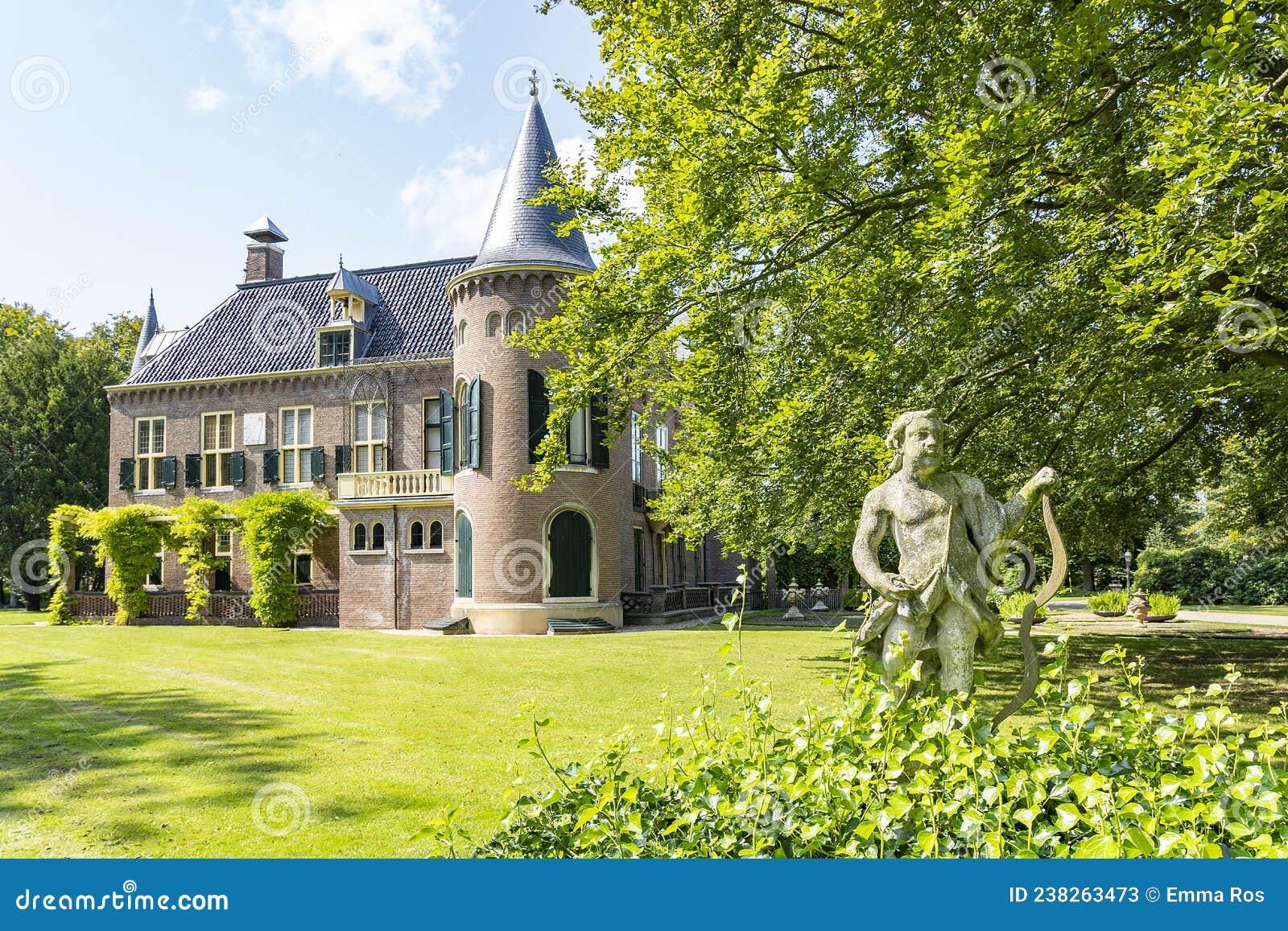 The Back View of a Beautiful Castle with a Stone Statue of Cupid in the ...