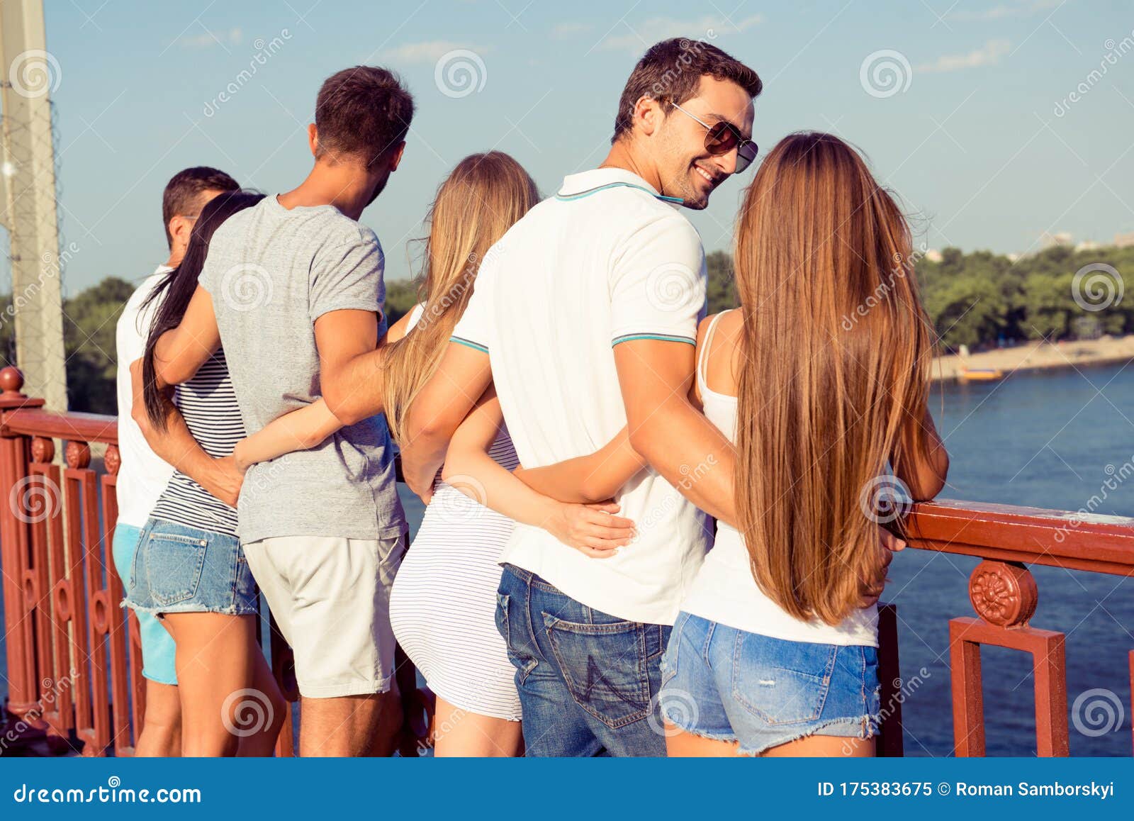 Back View of Best Friends Standing on the Bridge and Huging Stock Image ...