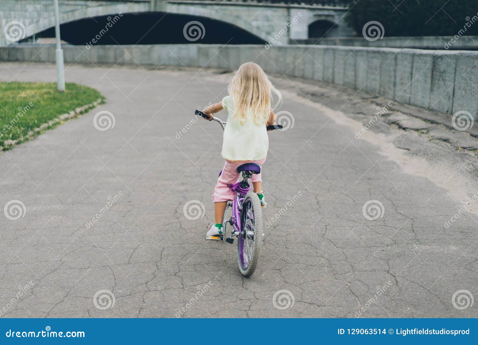 Back View of Blond Child Riding Bicycle Stock Photo - Image of rearview ...