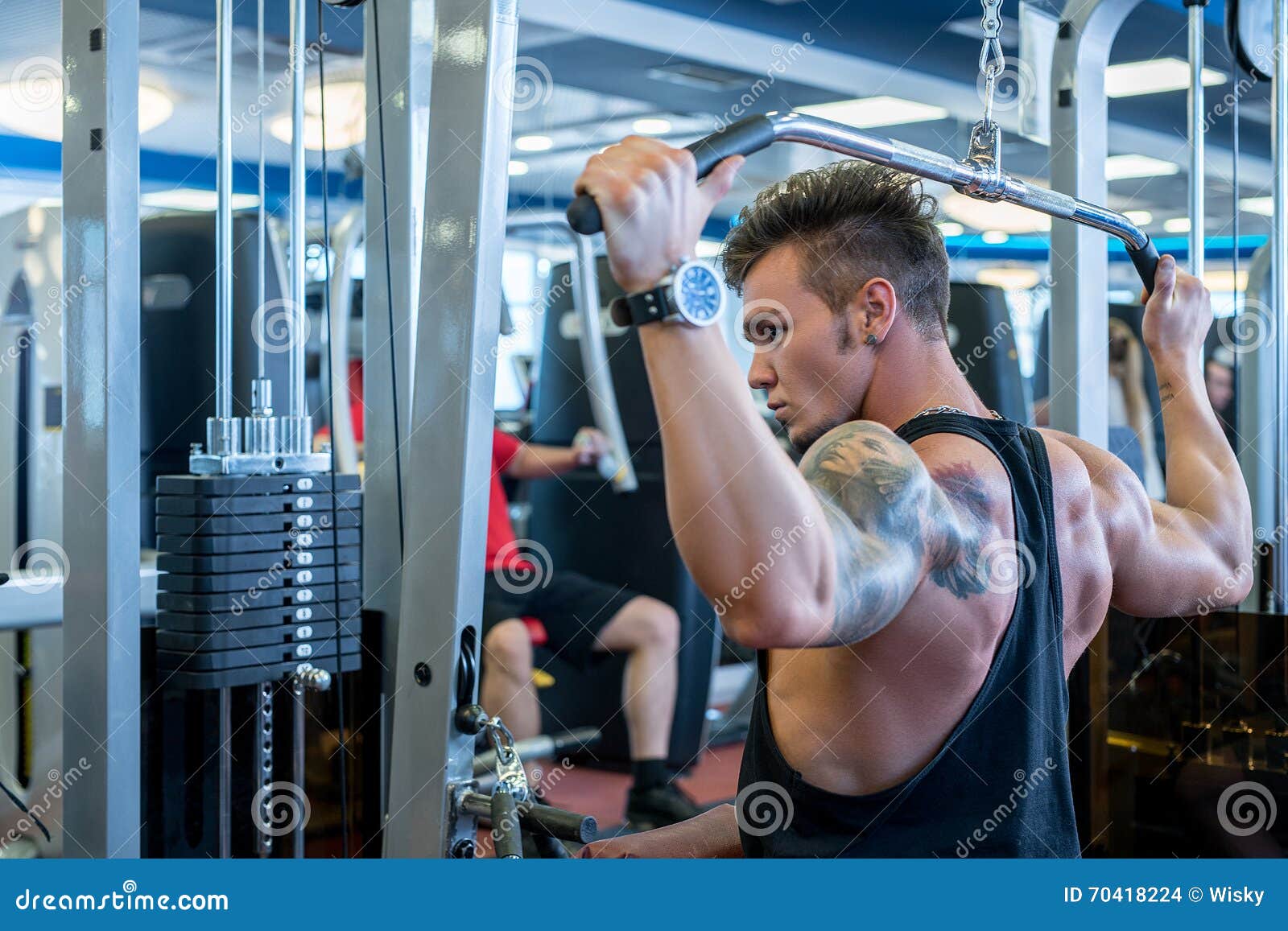 Back View of Bodybuilder Exercising on Simulator Stock Photo - Image of ...
