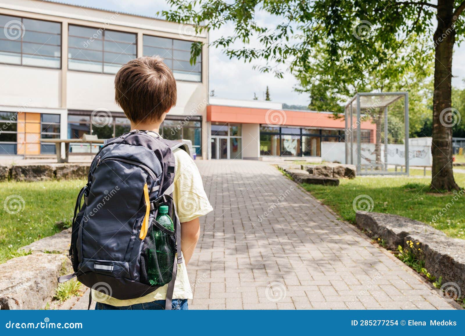 Back View of a Boy with a Backpack on His Back Going To School. Back To ...