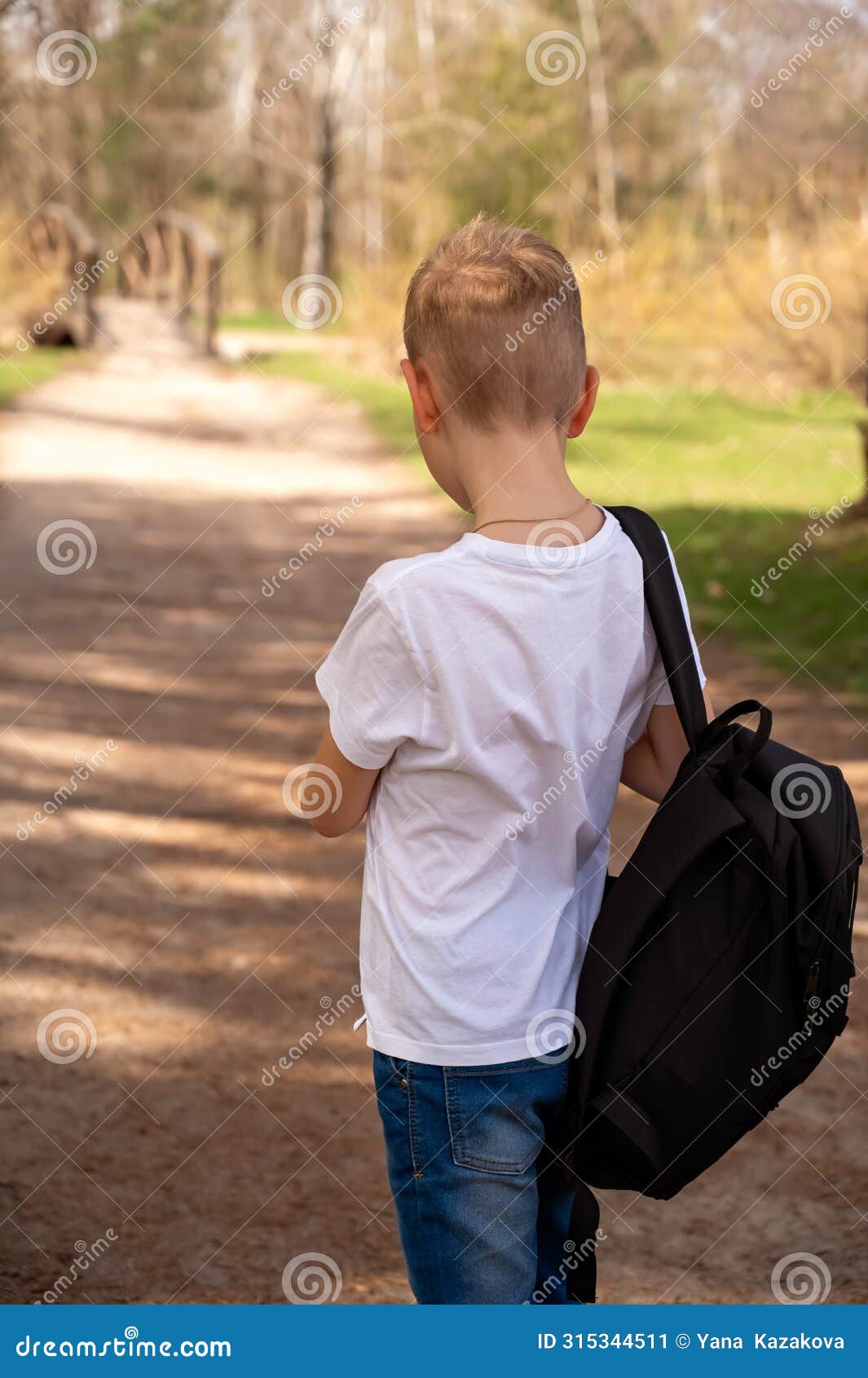 Back View of a Boy with Backpack Walking on a Path Stock Image - Image ...
