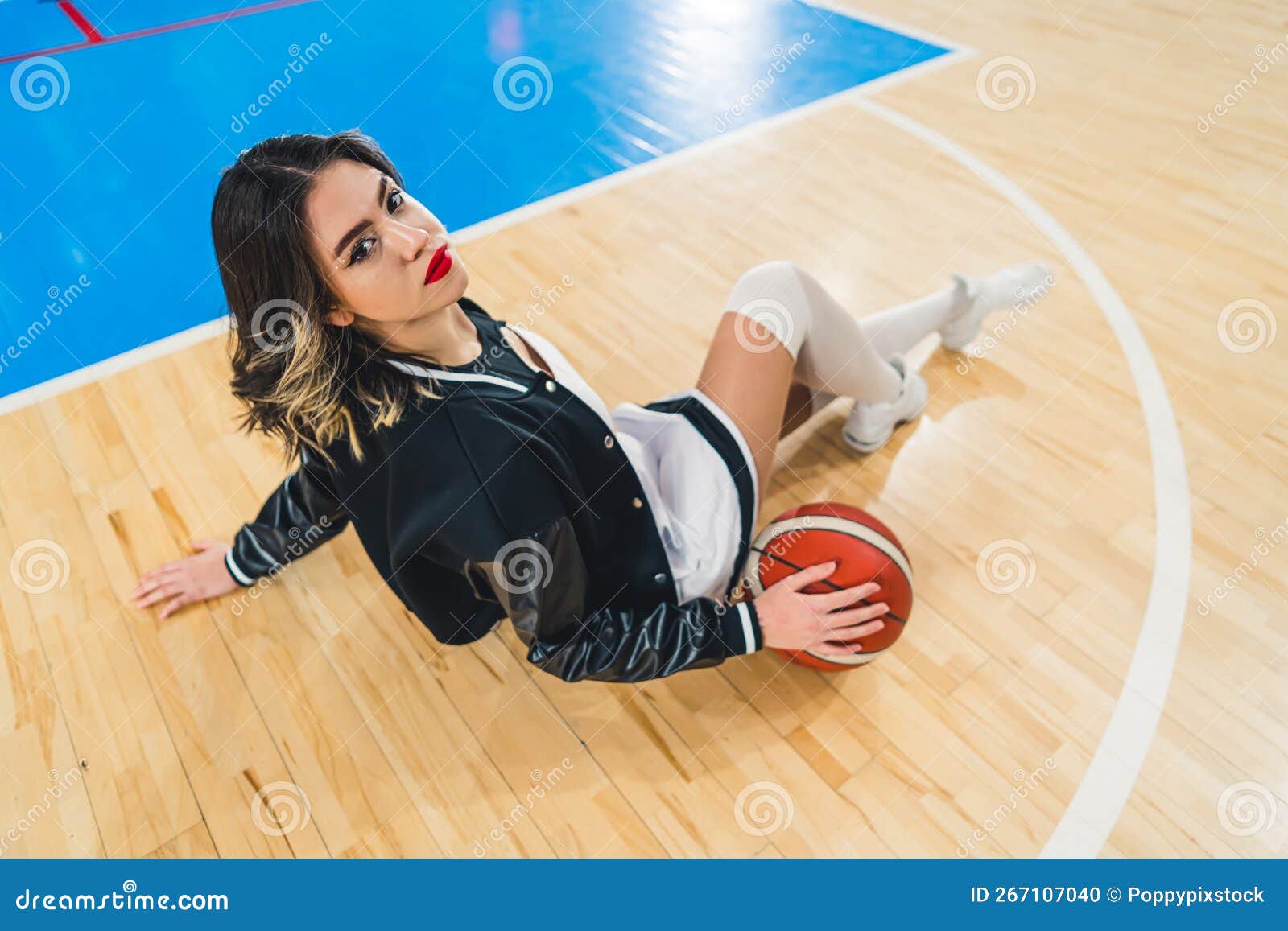 Back View Of Brunette Cheerleader Wearing Black Jumper And White