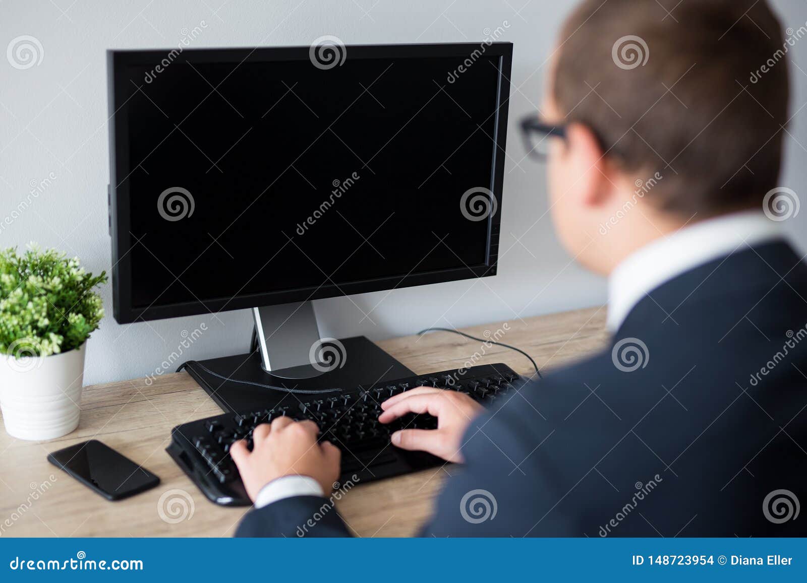 Back View of Business Man Using Computer in Office - Blank Screen with ... Back View of Business Man Using Computer in Office - Blank Screen with ...