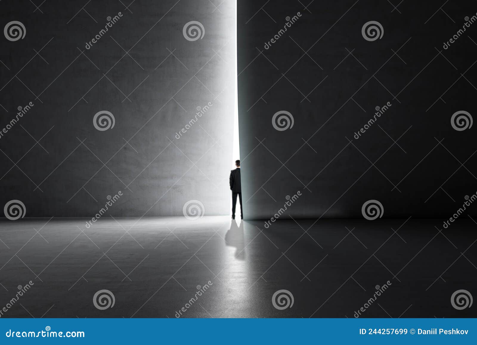 Back View of Businessman Stepping into the Light from Behind a Concrete ...