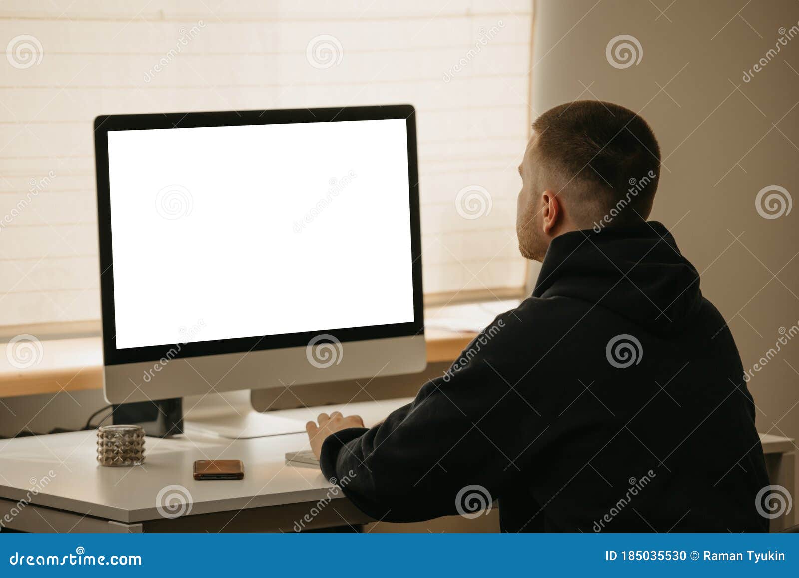A Back View of a Businessman Works Remotely Using an All-in-one ...