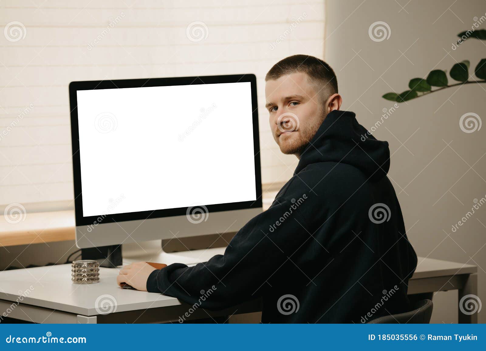 A Back View of a Businessman Works Remotely Using an All-in-one ...