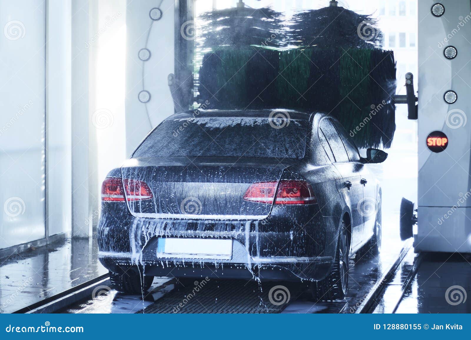 Back View of a Carwash Cleaning a Car with Rotating Brushes Stock Image ...