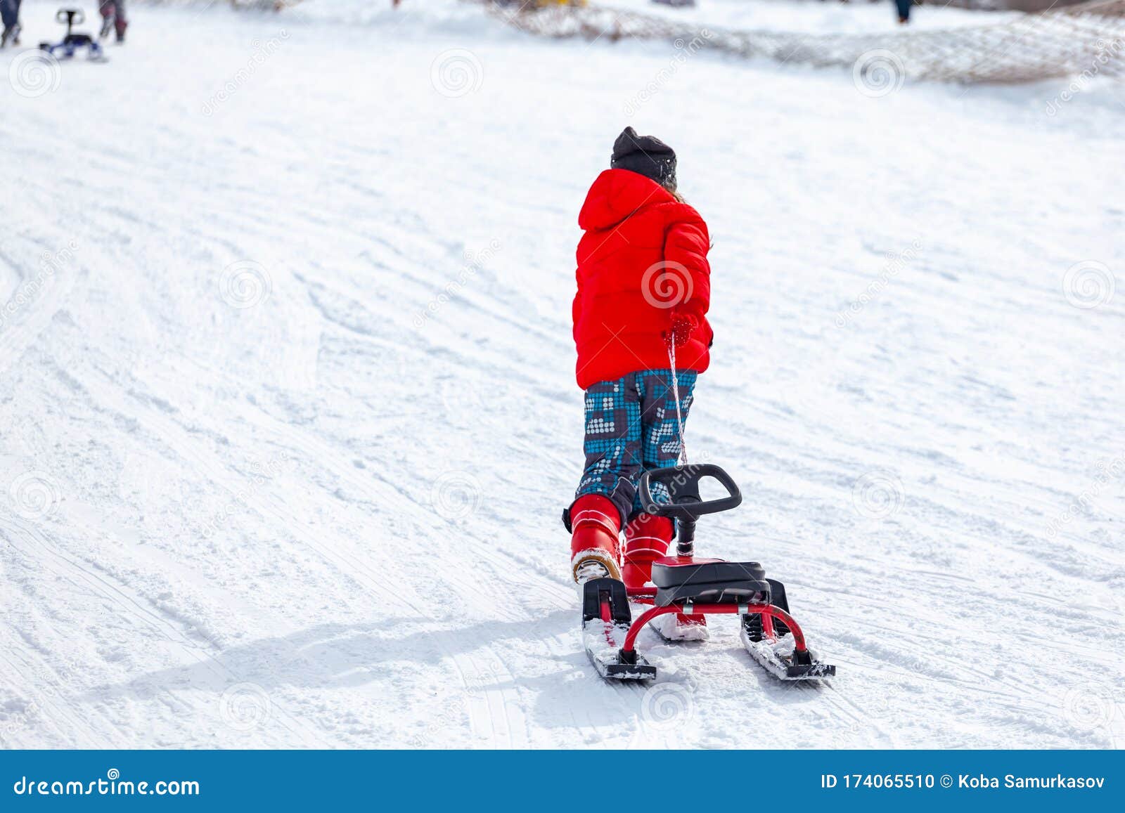 Back View of Child in Pulling Sledge and Running Up Snowy Slope Stock ...