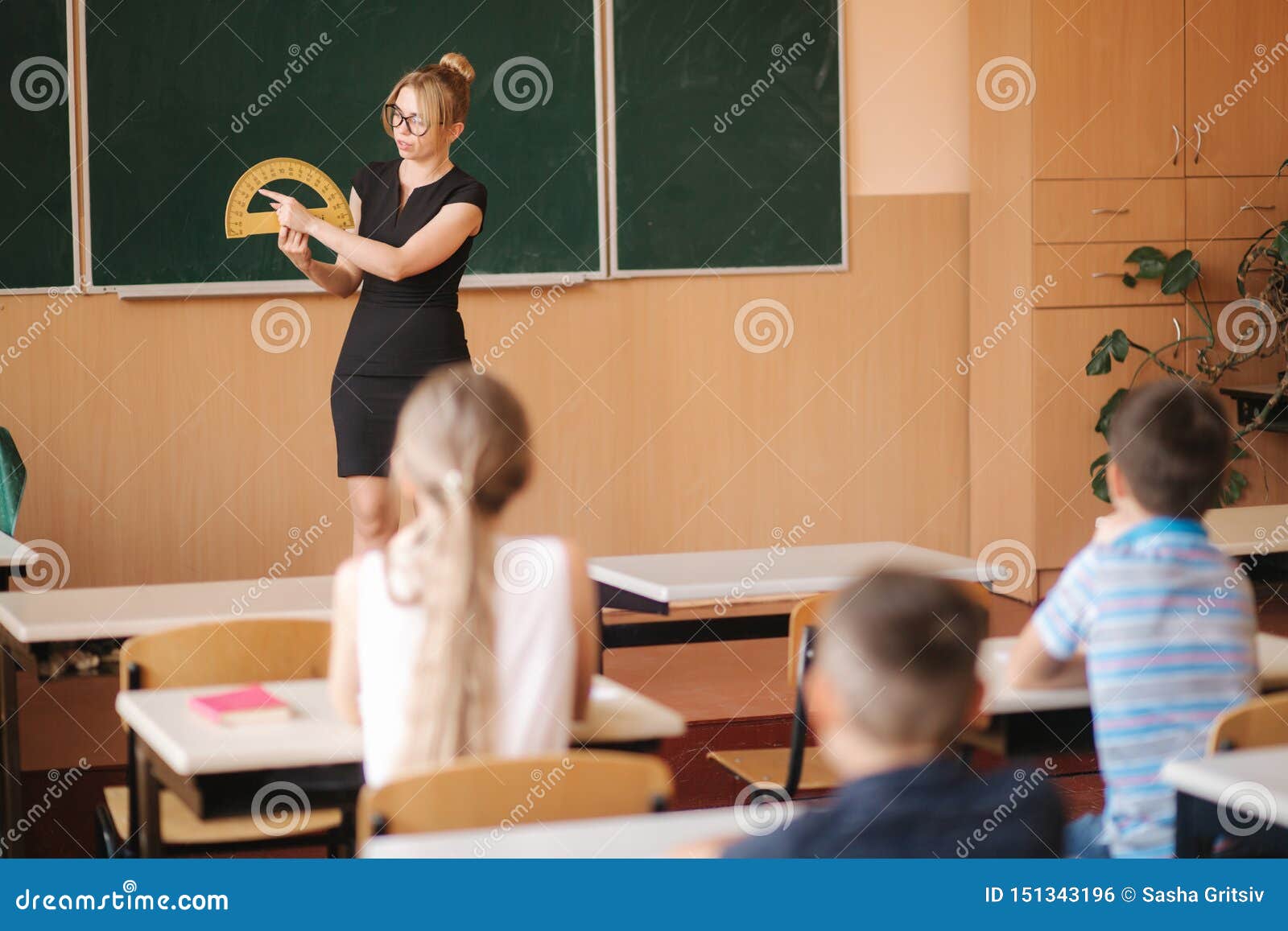 Back View of Children Sitting in the Class Room and Study. Elementary ...