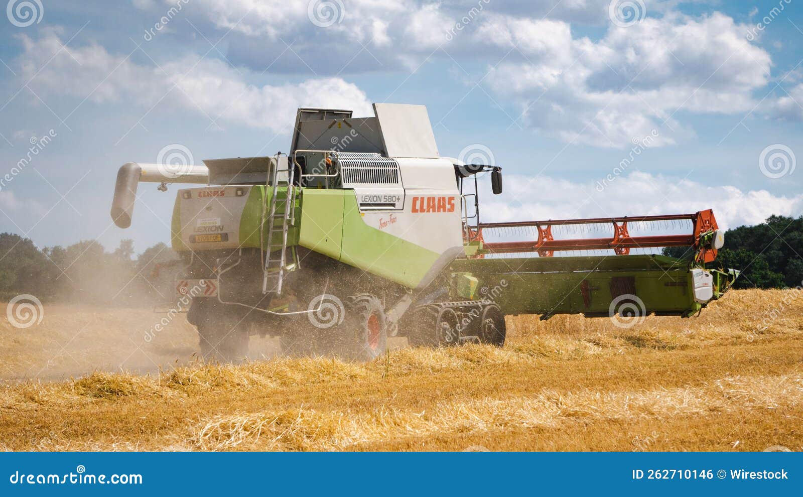Back View of a CLAAS Combine Harvester Harvesting a Field. Editorial ...