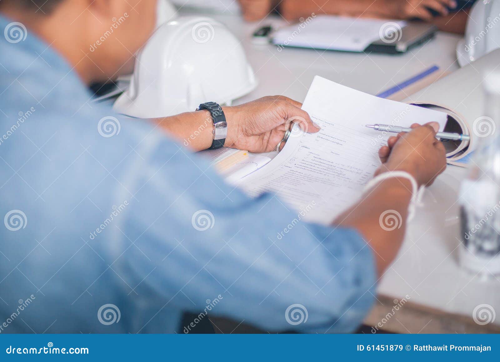 Back View of Construction Worker Reading Document Stock Image - Image ...
