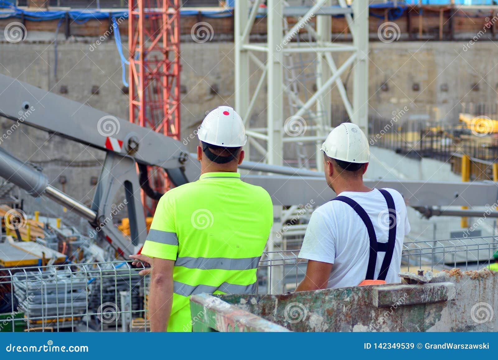 Back View of a Construction Worker Walking into a Building Sites ...